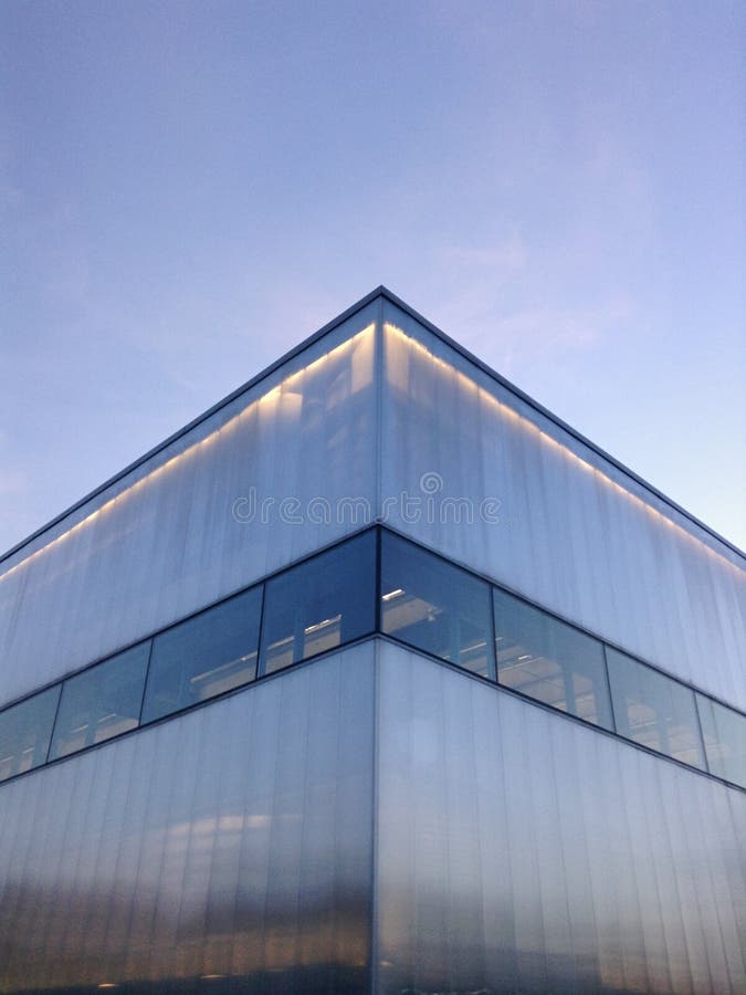 Office Building Corner Modern Style, Blue Building, Lights from the ... Office Building Corner Modern Style, Blue Building, Lights from the ...