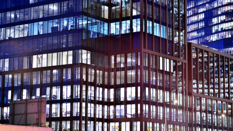 Office Building in the Evening with Lightened Workspaces. Stock Image ...