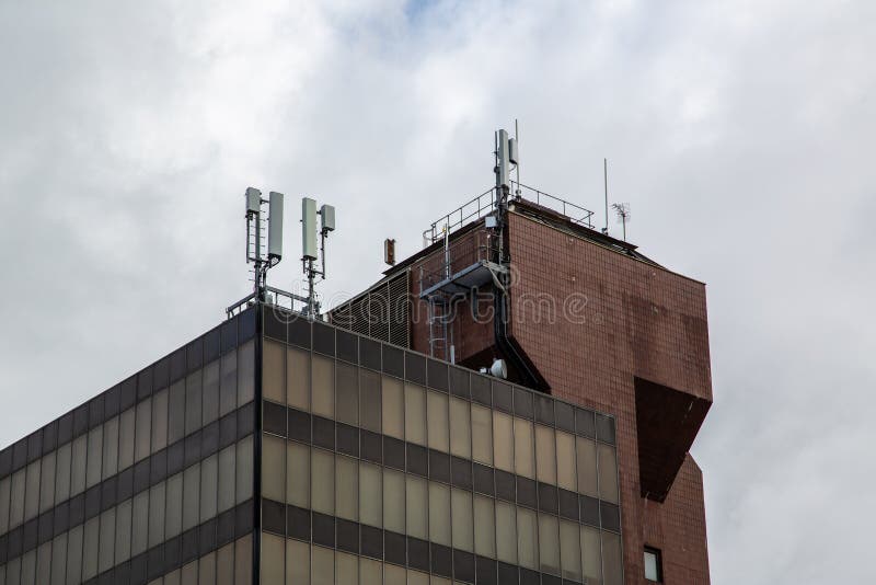An Office Building with Mobile Phone Antennas and Masts on the Roof ...