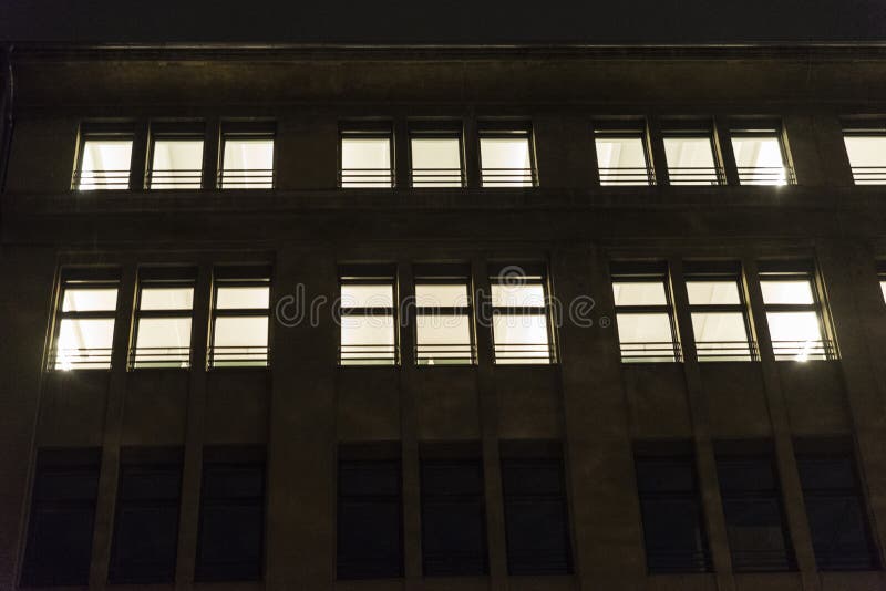 Building at Night with Lighted Windows Stock Photo - Image of ...