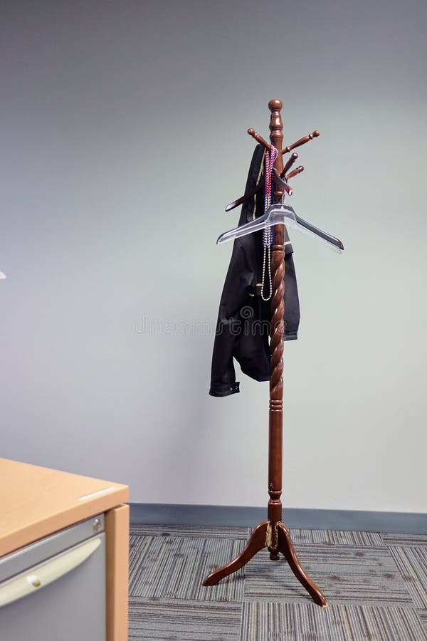 In Office Building Wood Coat Rack Stand Alone with Hanger on it Stock ...