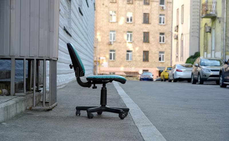 Office chair on the street stock image. Image of road - 76587891