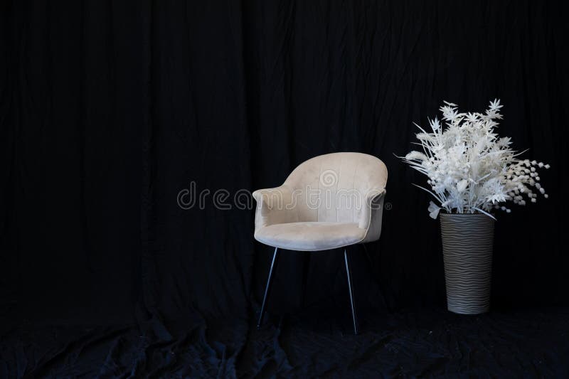 Office Chair and White Flower on Black Fabric Background Stock Image ...