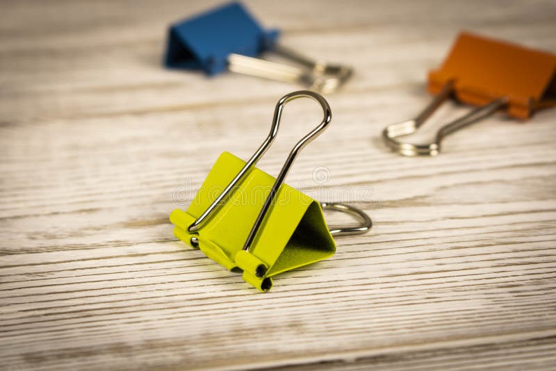 Office Clips on a Wooden Table. Close-up Stock Image - Image of binder ...