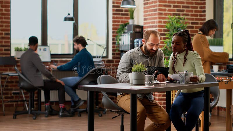 Office Colleagues Brainstorming Ideas To Plan Research Work Stock Image ...