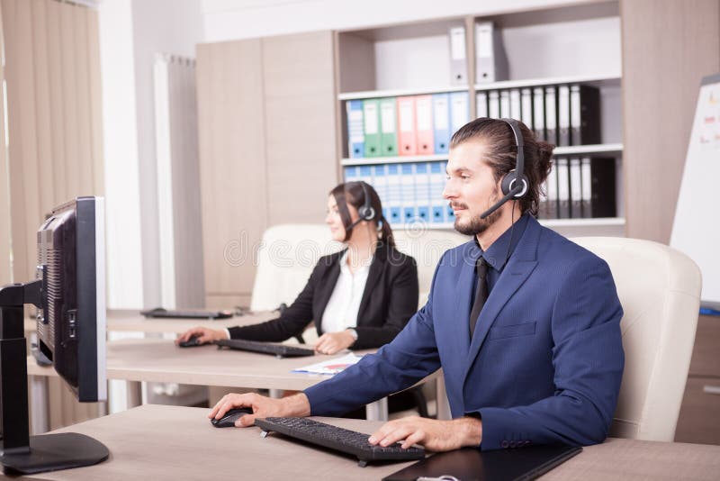 Office of Customer Support Line with People Working in it Stock Photo ...