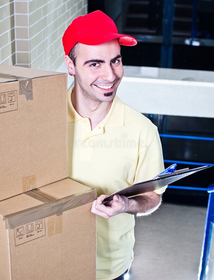 Delivery Man Handing in Parcel Stock Photo - Image of package, postman ...