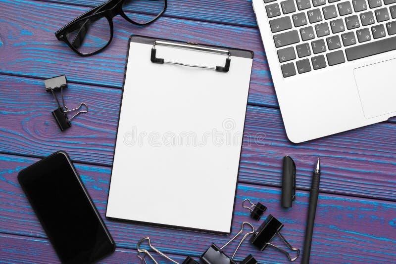 Office Desk with Blank Notepad, Laptop and Office Supplies Top View ...