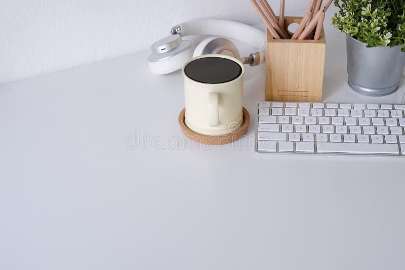 Office Desk Coffee Mug, Computer Keyboard, Pencil and Headphone Stock ...