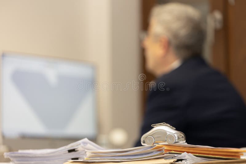 An Office Desk with a Computer and Many Files Stacked on it Editorial ...