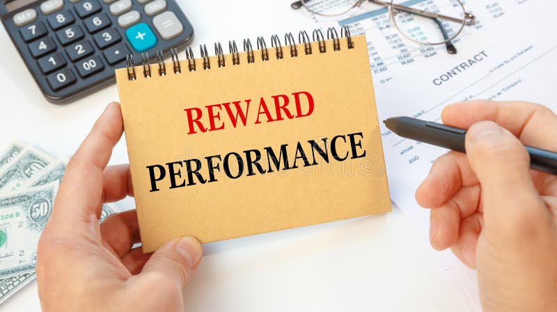 Office Desk with Devices and Documents. REWARD PERFORMANCE ...