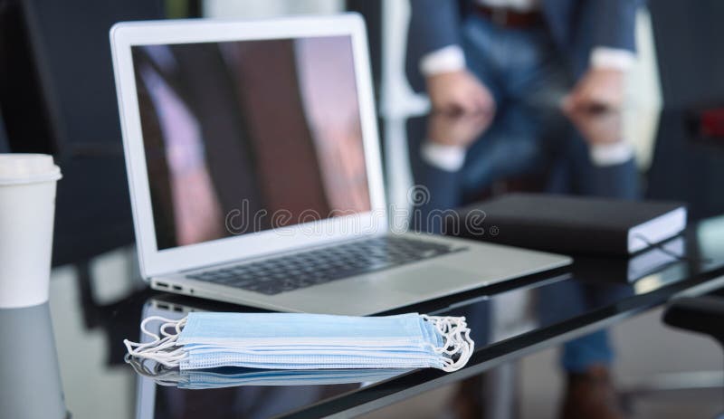 Office Desk with Face Mask, Laptop and Supplies Stock Image - Image of ...
