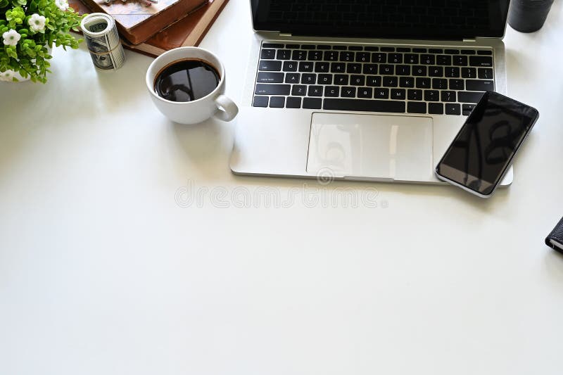 Office Desk Laptop, Mobile, Coffee and Book with Copy Space Top View ...