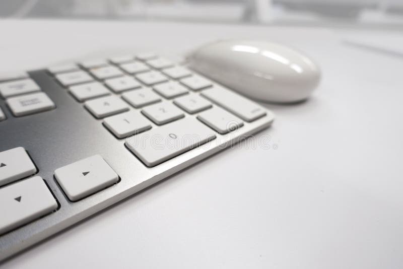 Computer Wireless Keyboard and Mouse on White Desk Stock Photo - Image ...