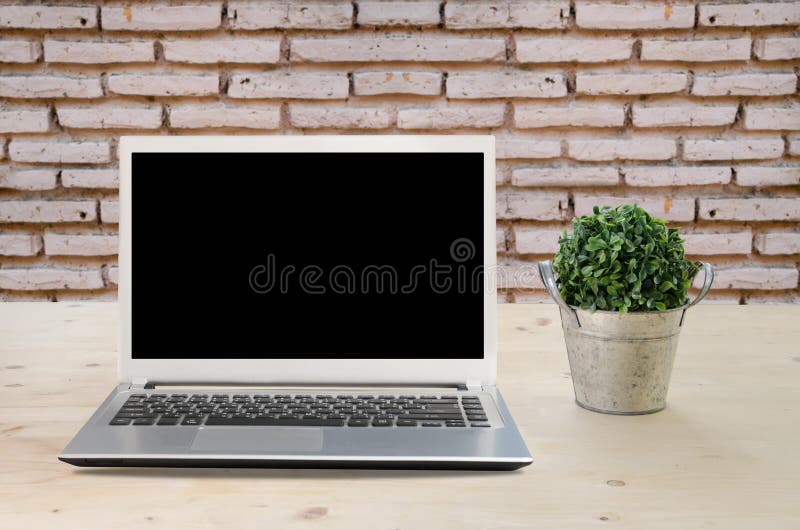 Office Desk with Notebook, Tree Pot and Brick Wall Texture. Stock Image ...