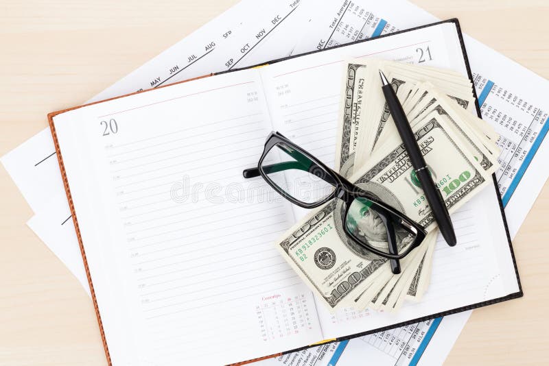 Office Desk with Reports, Blank Notepad and Money Cash Stock Photo ...