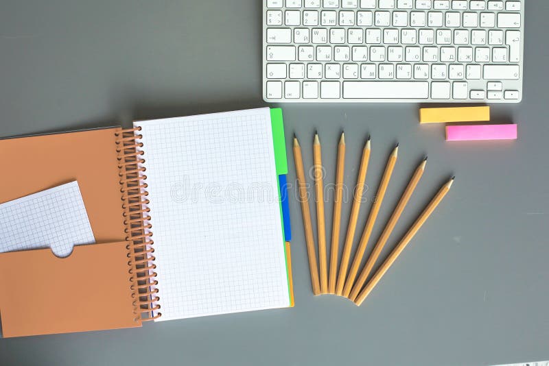 Office Desk Table with Blank Notebook, Computer, Supplies and Coffee ...