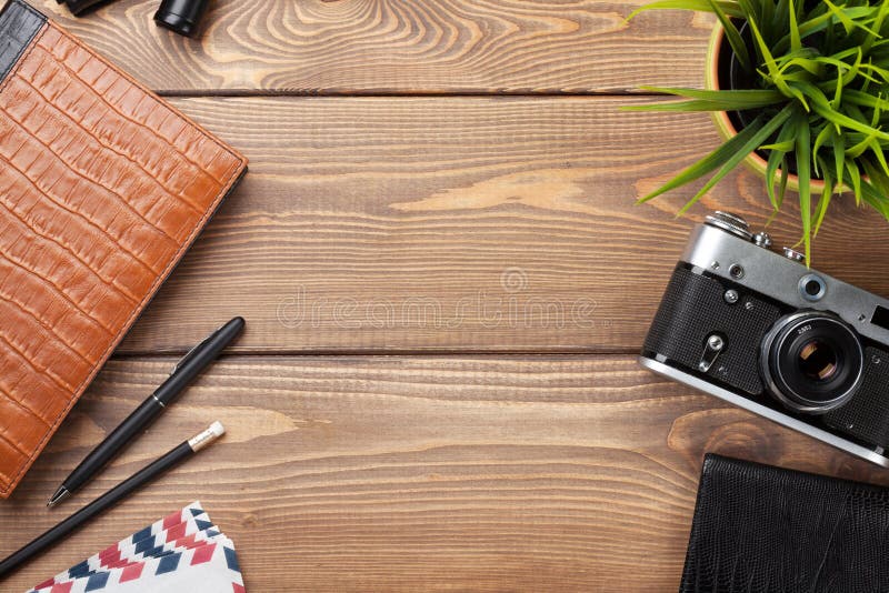 Office Desk Table with Camera, Supplies and Flower Stock Photo - Image ...