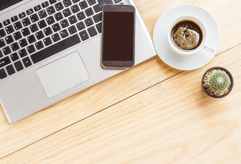 Office Desk Table with Laptop Computer, Coffee Cup and Smart Phone ...