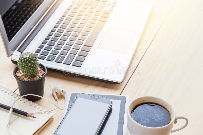 Office Desk Table with Laptop Computer, Coffee Cup and Smart Phone ...