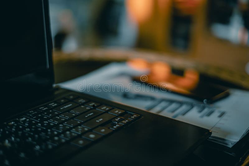 Office Desk Workspace with Laptop, Graph Document and Pen and Smart ...