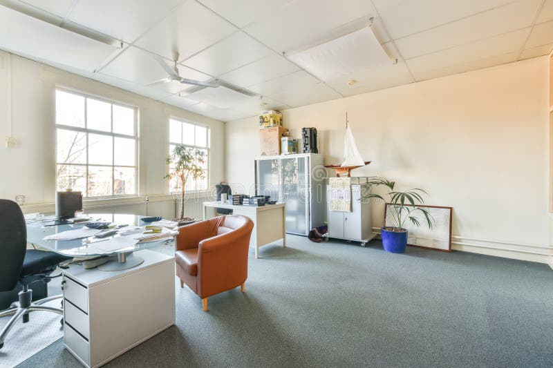 An Office with Desks and Chairs and a Large Window Editorial Image ...