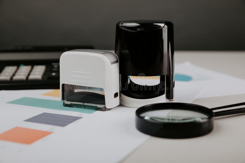 Office Desktop with Documentsm Magnifier and Stamp Close-up Stock Photo ...