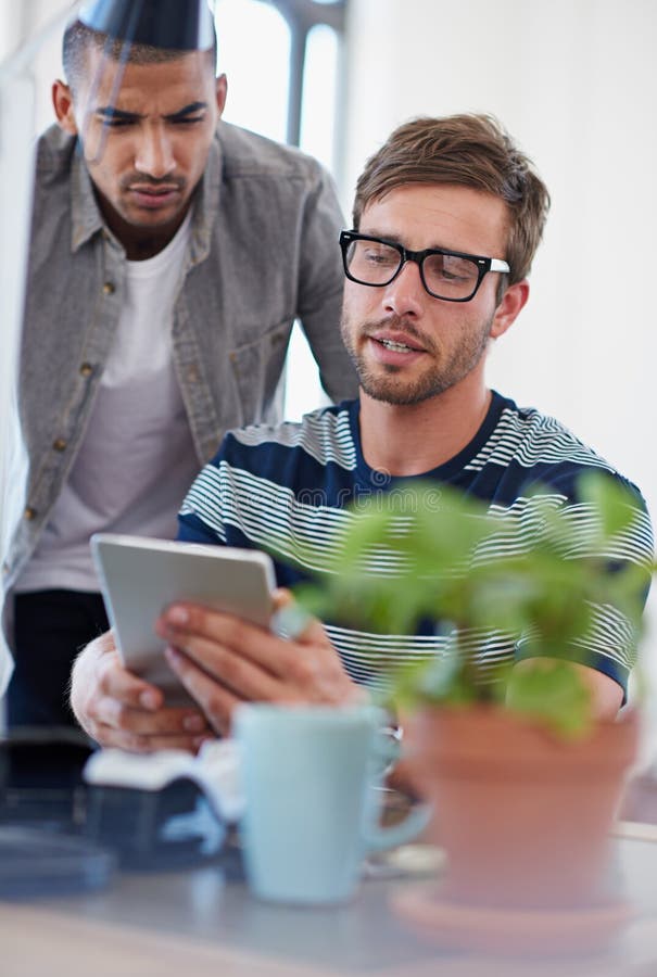 This Office is Device Central. Two Coworkers Looking at a Digital ...