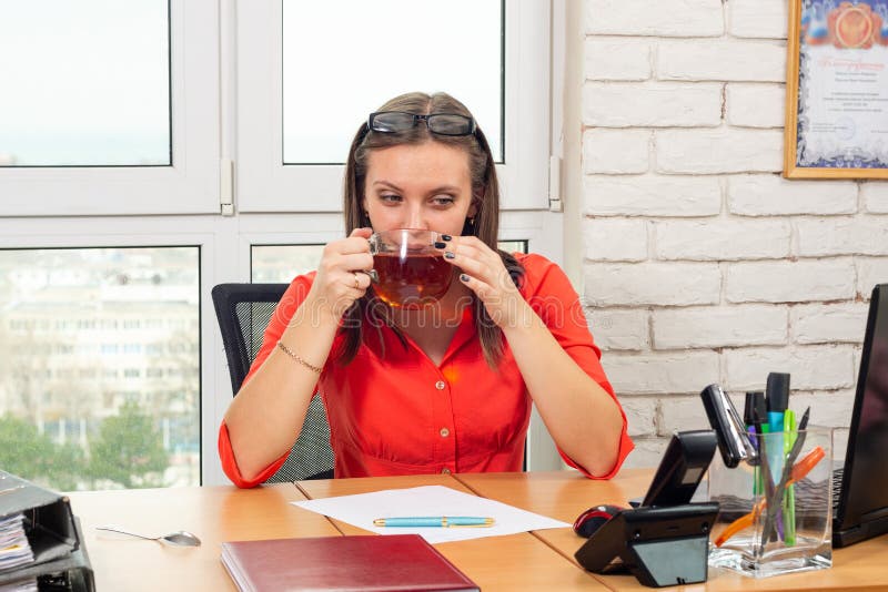 An Office Employee Drinks Tea at the Workplace at Lunchtime Stock Image ...