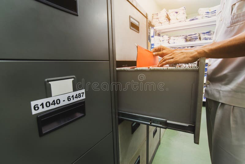 Office Employee Searching Files in Drawers Stock Image - Image of data ...