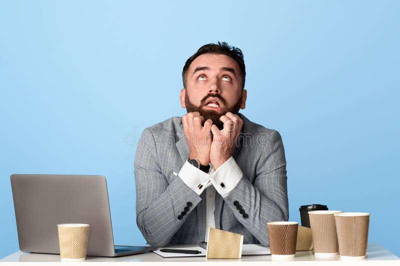 Office Employee Surrounded by Empty Coffee Cups Suffering from Work ...