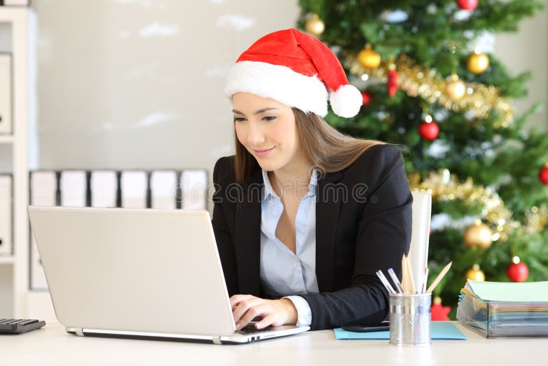Office Employee Working in Christmas with a Laptop Stock Photo - Image ...