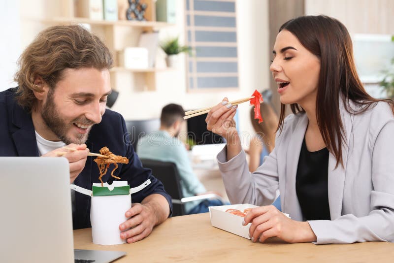 Office Employees Having Lunch at Workplace Stock Photo - Image of ...