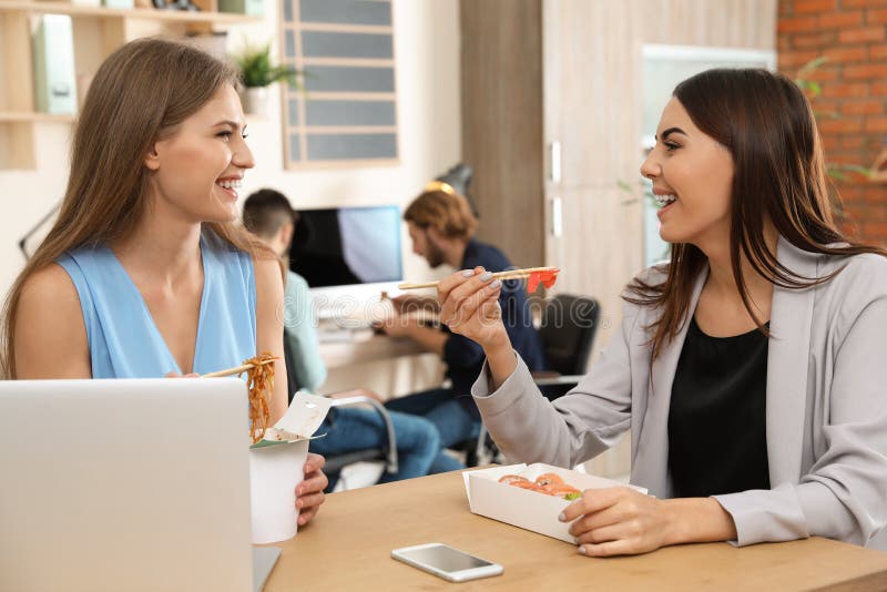 Office Employees Having Lunch at Workplace Stock Image - Image of ...