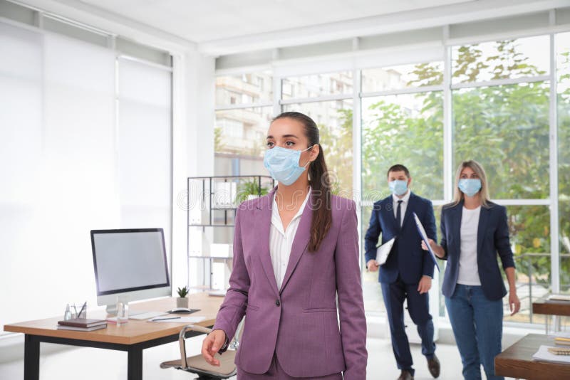 Office Employees in Respiratory Masks at Workplace Stock Photo - Image ...