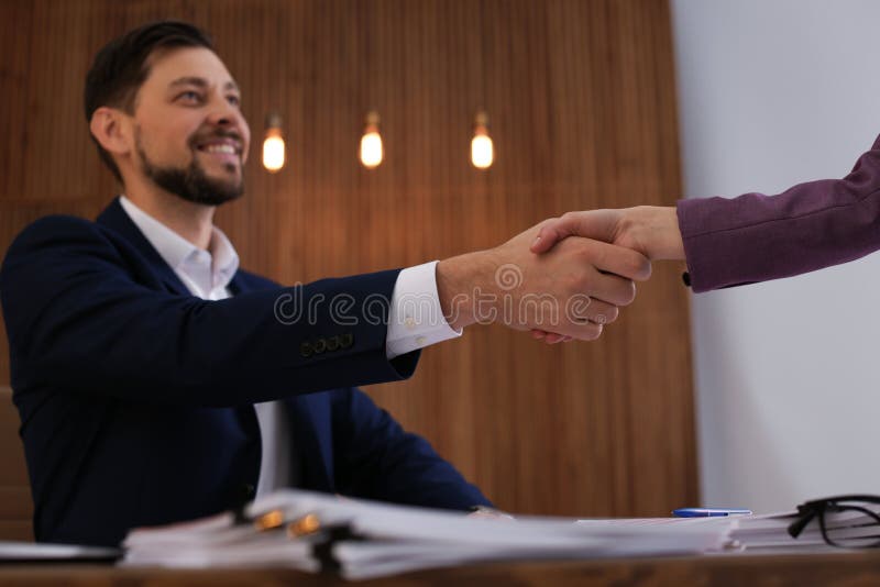 Office Employees Shaking Hands Over Table with Documents Stock Image ...