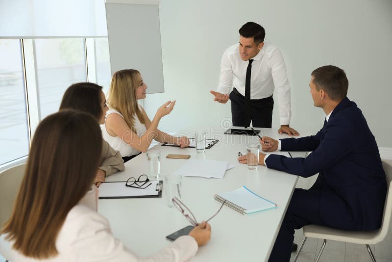 Office Employees Talking at Table during Meeting Stock Image - Image of ...