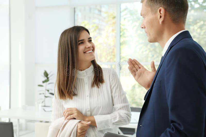 Office Employees Talking at Workplace during Break Stock Image - Image ...