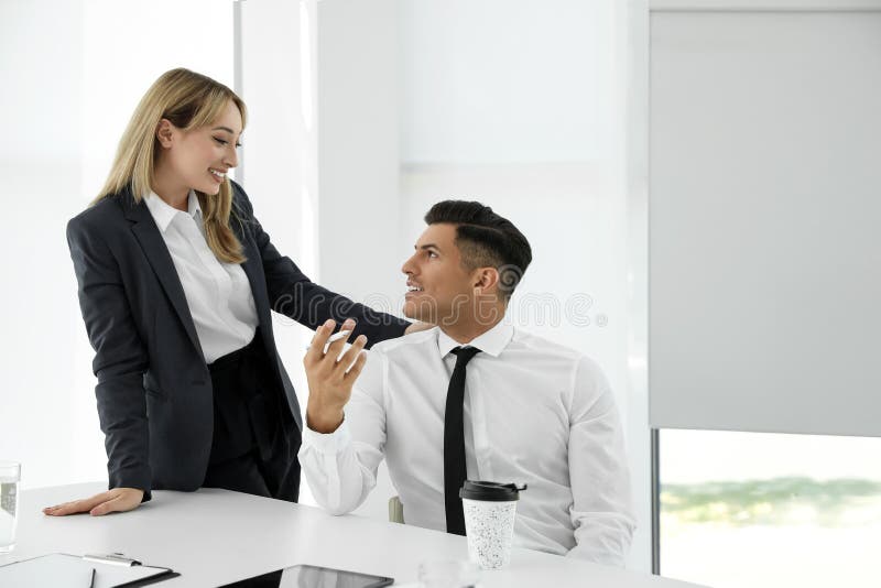 Office Employees Talking at Workplace during Break Stock Photo - Image ...