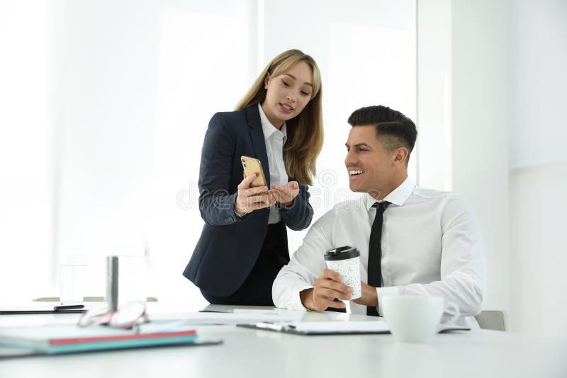 Office Employees Talking at Workplace during Break Stock Photo - Image ...