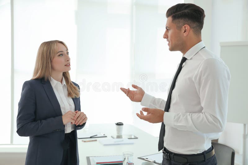Office Employees Talking at Workplace during Break Stock Image - Image ...