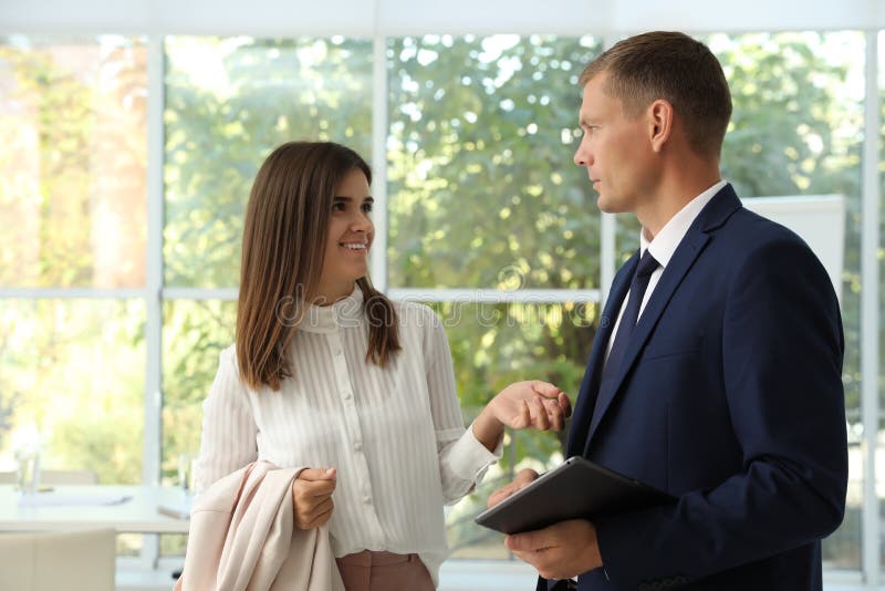 Office Employees Talking at Workplace during Break Stock Photo - Image ...