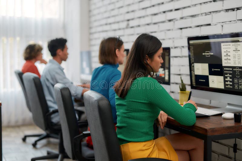 Office Life. Young Creative People Working on Computers while Sitting ...