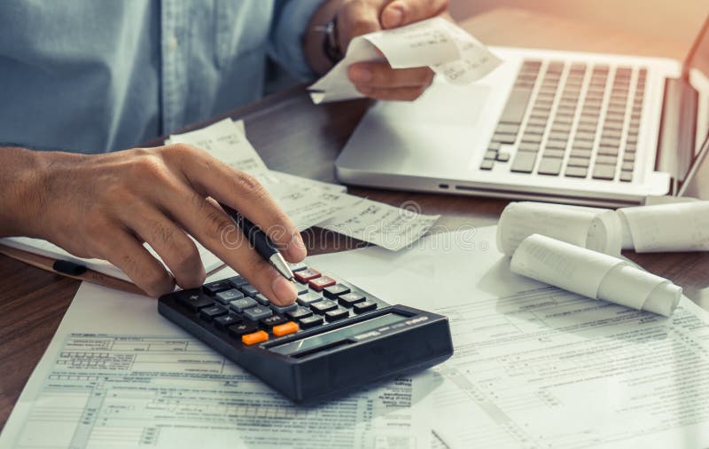 The Office Man Calculate Bills with Using Calculator in Home Office ...