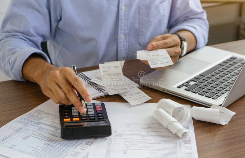 Business Man Calculate Bills with Using Calculator in Home. Stock Image ...
