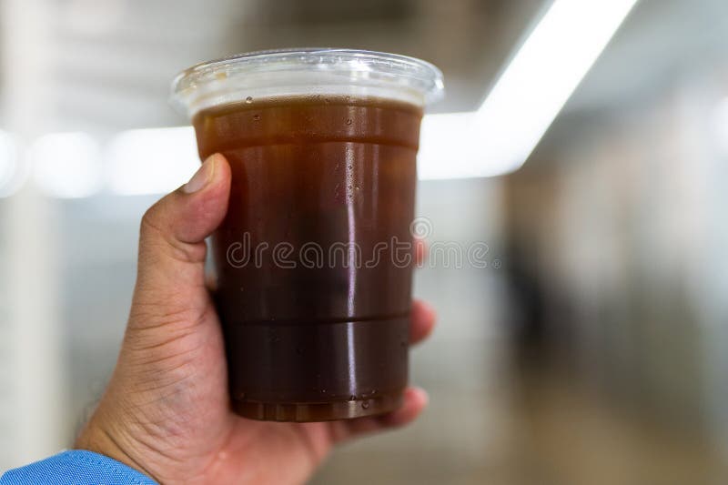 Office Man Holding a Iced Americano in Transparent Plastic Cup Stock ...
