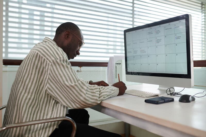 Office Manager Checking Schedule Stock Photo - Image of glasses ...