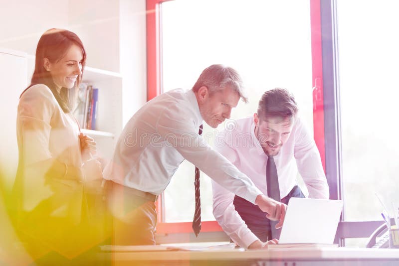 Manager Explaining on Computer To Employees Coworkers in Office Stock ...