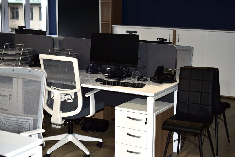 Office PC Desk with White Bedside Tables and Chairs Stock Image - Image ...