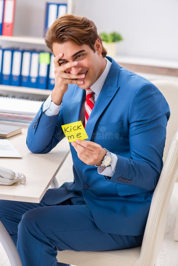 The Office Prank with Kick Me Message on Sticky Note Stock Photo ...